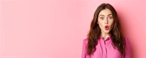 Premium Photo Close Up Of Intrigued Young Woman Gasping Saying Wow
