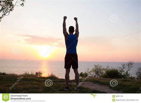 Young Male Stretching Before Fitness Training Session At The Park