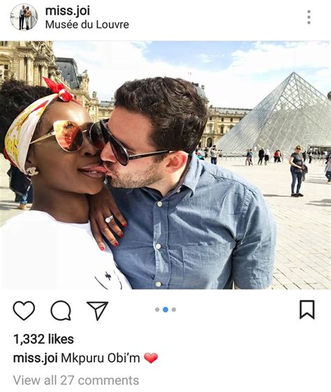 A Man And Woman Kissing In Front Of The Pyramids