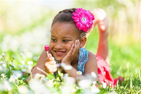 Outdoor Portrait Of A Cute Young Black Girl Smiling African Pe Stock