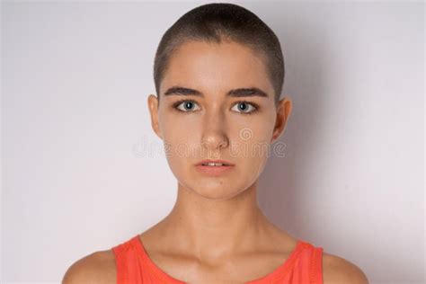 Caucasian Young Woman With Shaved Head Young Woman Looking Into The