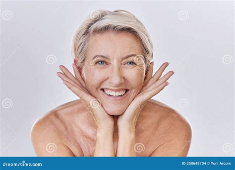 Portrait Of A Happy Smiling Mature Caucasian Woman Looking Positive And