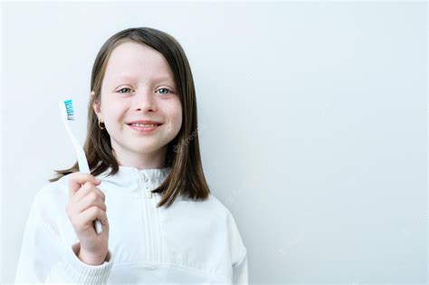 Premium Photo A Girl With Dark Hair On A White Background Holds A