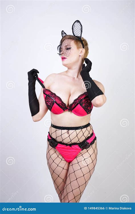 Cute Chubby Girl With Short Hair In A Bright Pink Lingerie And Fetish