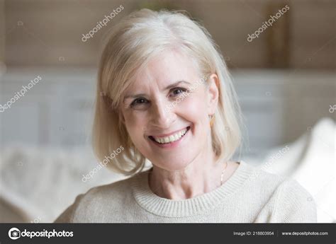 Happy Middle Aged Elderly Grey Haired Woman Looking At Camera Stock