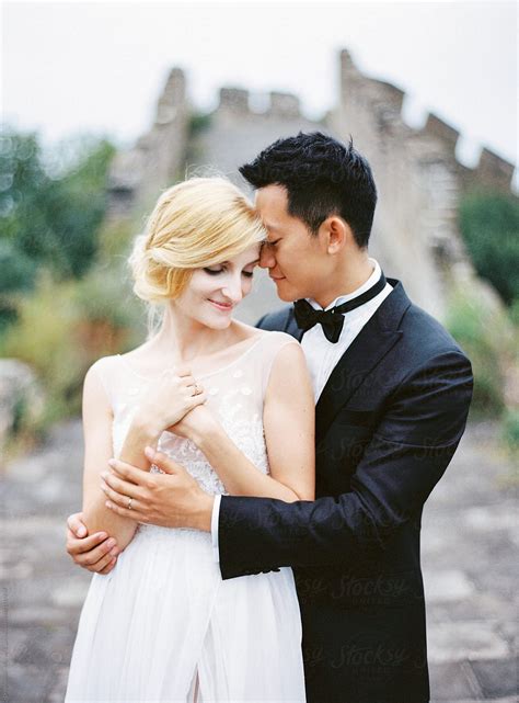Gentle Couple Embracing And Posing By Stocksy Contributor Dreamwood