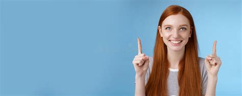 Amused Excited Happy Smiling Redhead Girl Look Pointing Up Grinning