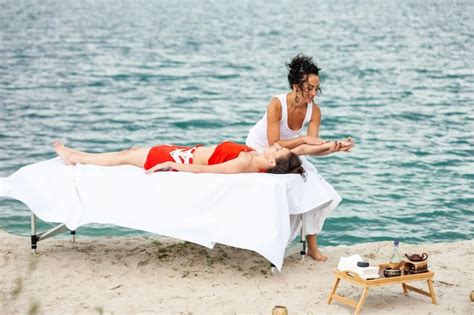 Premium Photo Smiling Massage Therapist Doing A Back Massage On Outdoor