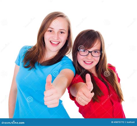 Muchachas Adolescentes Que Muestran Los Pulgares Para Arriba Foto De