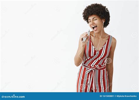 Indoor Shot Of Creative And Happy Carefree African American Woman With