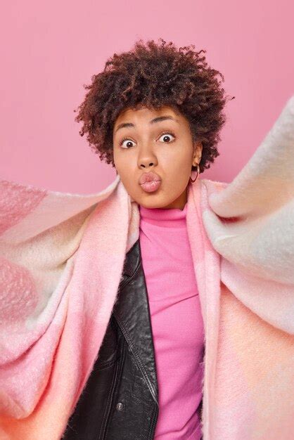 Premium Photo Vertical Shot Of Pretty Surprised Young Woman Looks