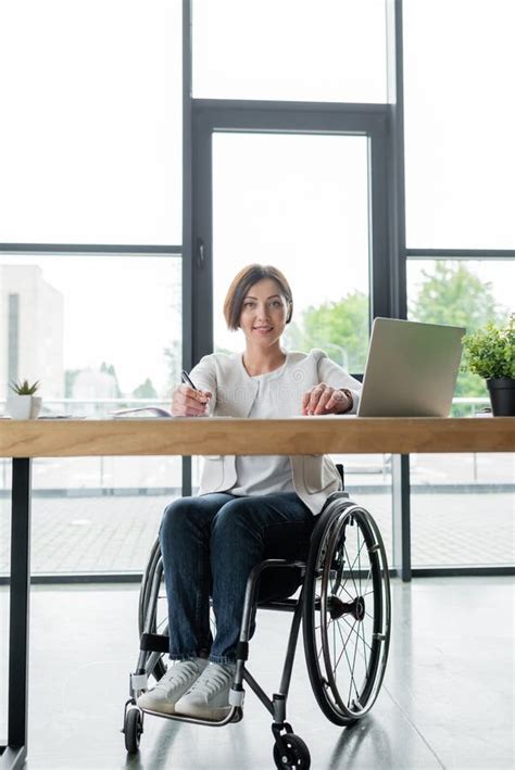 Successful Businesswoman In Wheelchair Smiling At Stock Image Image
