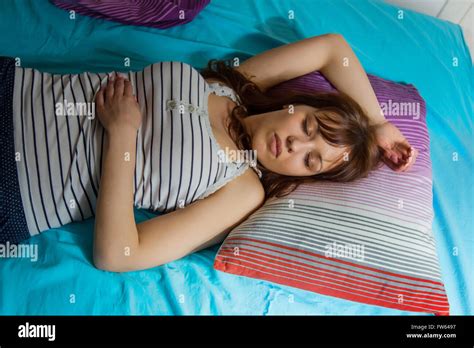 Beautiful Young Woman Sleeping In The Bed Relaxing And Peaceful Stock