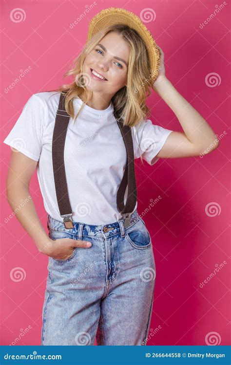 Happy Caucasian Blond Girl In Casual White Shirt With Suspenders