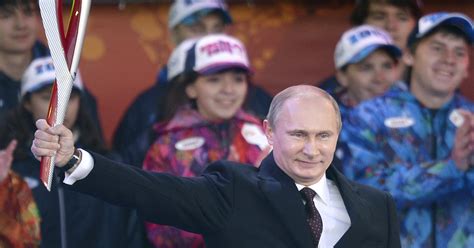 Vladimir Putin Lights Olympic Flame For Sochi On Red Square