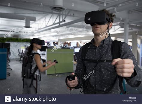 computer programmers testing virtual reality simulator glasses and