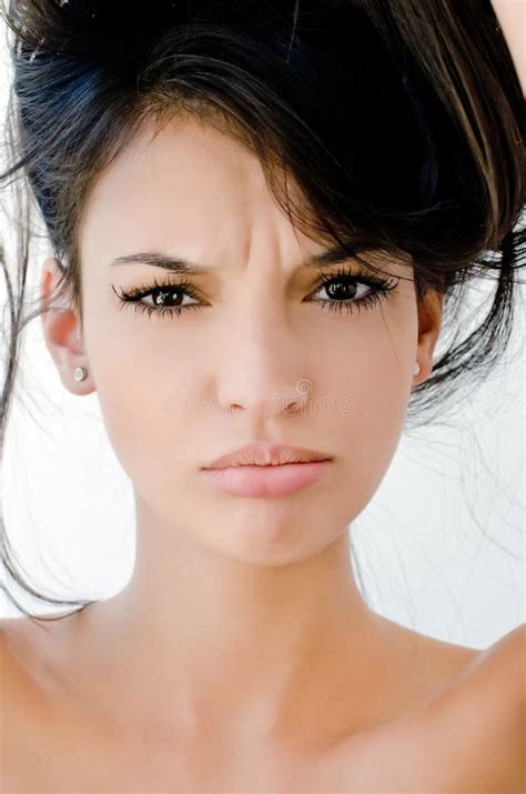 Close Up On Girl Frowning Looking Unhappy And Stressed Stock Image