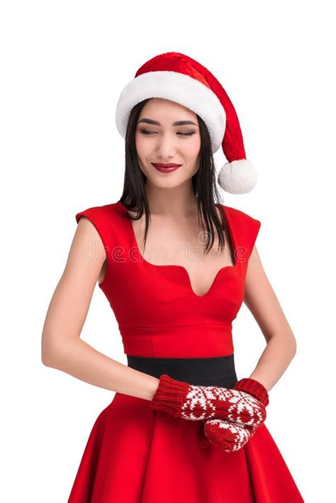Portrait Of Smiling Asian Woman In Santa Costume And Mittens Stock