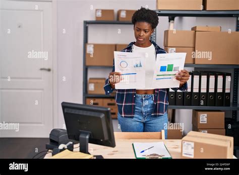 African American Woman Ecommerce Business Worker Reading Document At