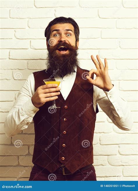 Handsome Bearded Man With Long Beard And Mustache Has Stylish Hair On