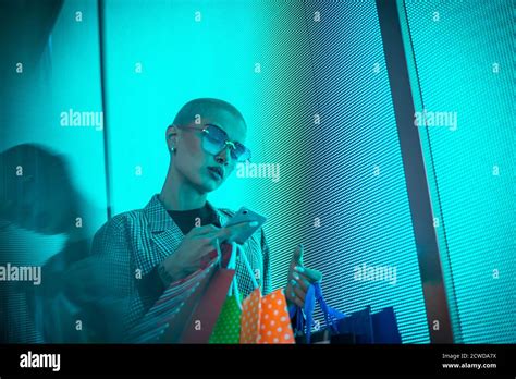 Image Of A Beautiful Young Woman Posing Against A Led Panel Shaved