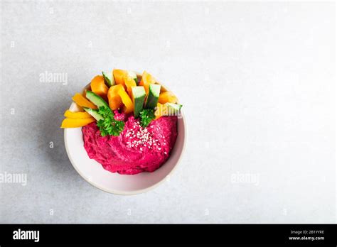 Homemade Beetroot Hummus Made From Chickpeas And Beetroot In White Bowl