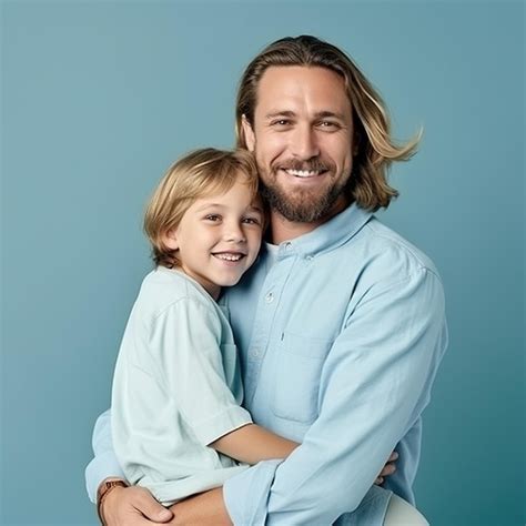Premium Photo Happy Smiling Father And Son Hugging