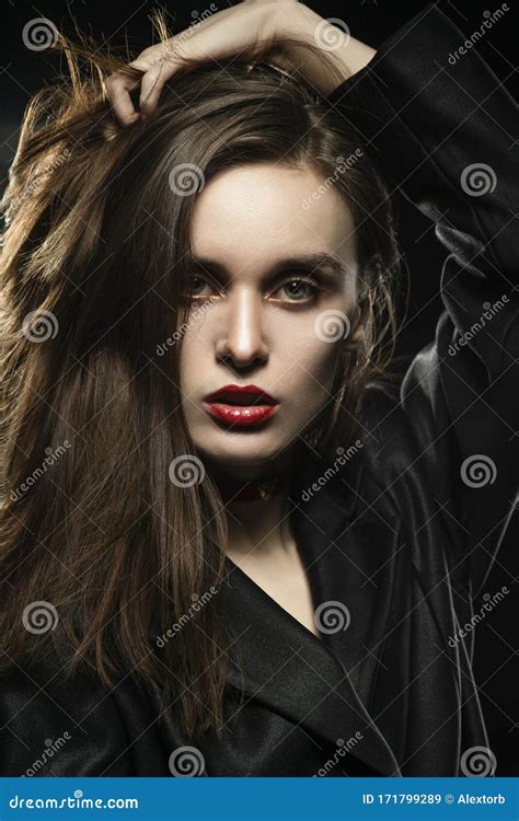 Beautiful Slim Girl Model With Red Lips Wearing A Black Blazer