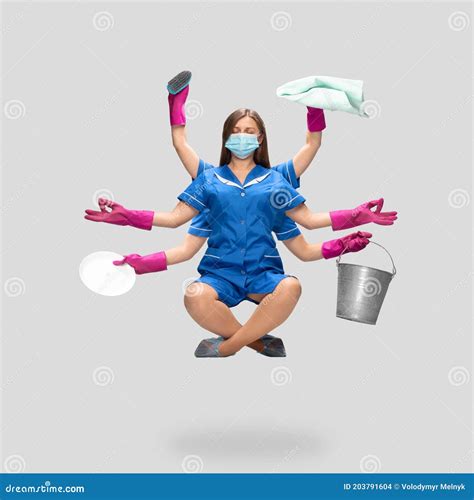 Female Housemaid In Pink Gloves And Blue Uniform Multitask Like Shiva