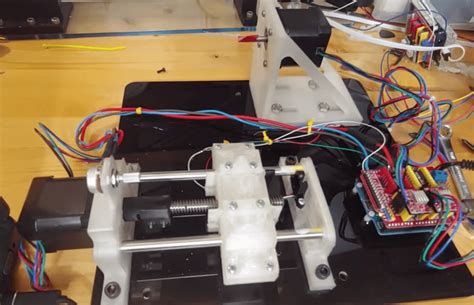 use an arduino and a pair of stepper motors to automatically wind