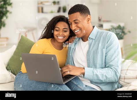 Technology At Home Glad Millennial African American Wife Hugging