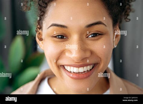 Closeup Photo Of A Beautiful Positive Curly Haired African American