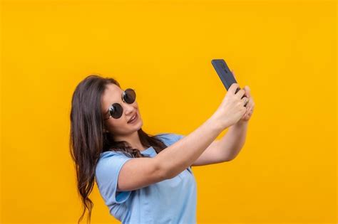Premium Photo Casual Woman With Sunglasses Taking A Selfie With