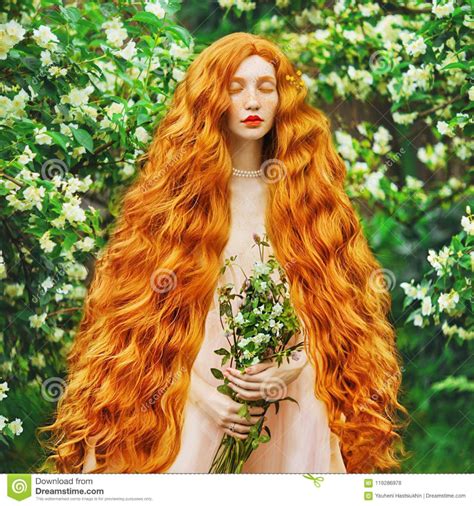 Young Beautiful Red Haired Girl With Very Long Curly Hair With Freckles