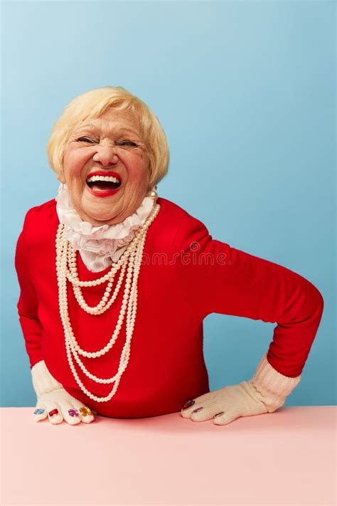 Happy Smiling Old Woman Grandmother In Stylish Red Dress And Pearl