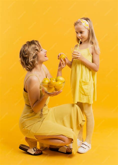 Free Photo Mother Showing Her Daughter Lemons