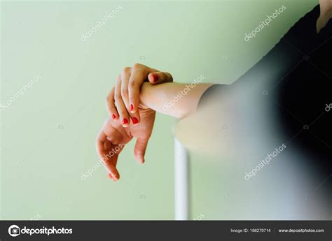 Elegant Beautiful Ballerina With A Perfect Body Doing Stretching