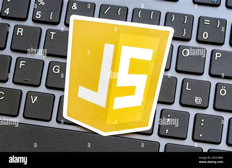 js javascript programming language logo laying on a modern computer