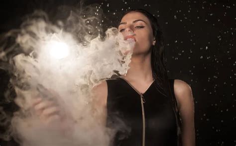 Young Beautiful Brunette Woman Smoking Vaping E Cigarette With Smoke