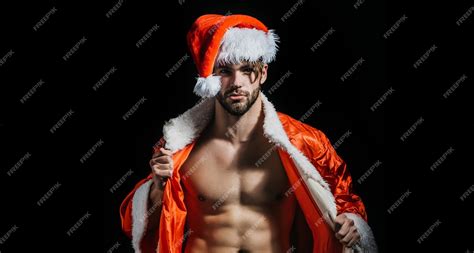 Premium Photo Christmas Sexy Santa Young Men In Santa Hat Strip For