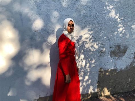 Premium Photo Young Woman Standing Front Of Wall