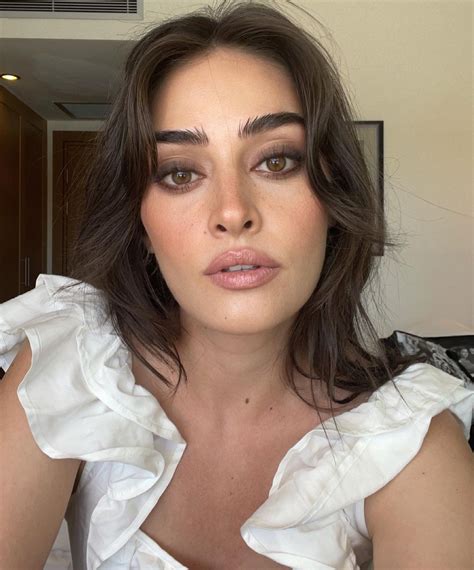 Esra Bilgiç Looks Fierce In A White Ruffled Top And Smokey Eyes Lens