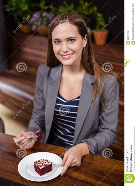 Woman Eating A Cake Stock Image Image Of Person Holding 66981815