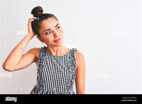 Beautiful Woman With Bun Wearing Casual Dresss Standing Over Isolated