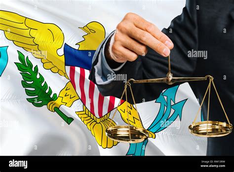 Judge Is Holding Golden Scales Of Justice With United States Virgin