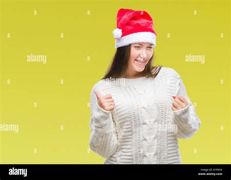 Young Beautiful Caucasian Woman Wearing Christmas Hat Over Isolated