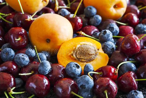 Summer Berries And Fruits Sweet Cherries Blueberries And Apricots