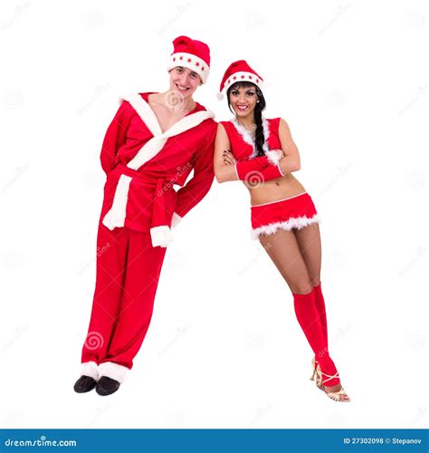 Jeunes Couples Heureux Portant Des Vêtements Du Père Noël Photo Stock