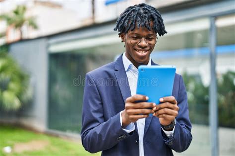African American Man Executive Smiling Confident Using Touchpad At Park