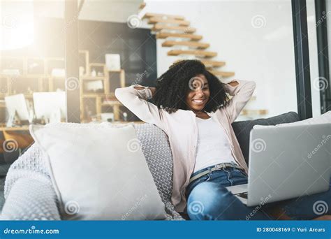 What Better Way To Unwind An Attractive Young Woman Relaxing At Home